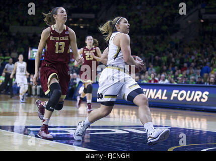 Boston College forward Alexa Coulombe throws a pass between Notre Dame ...