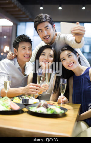 Chinese friends having dinner together Stock Photo - Alamy