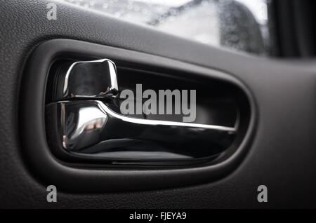 Modern car interior door handle close up. Metallic Car door opener ...