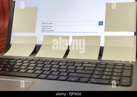 Laptop screen covered with sticky notes with different appointments on ...