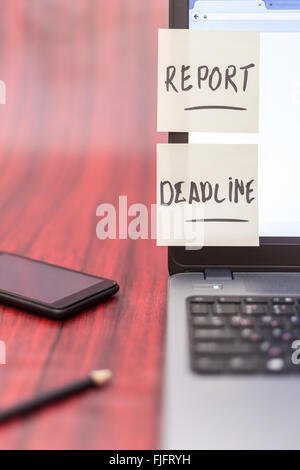 Two blank yellow notes sticked to a laptop display Stock Photo - Alamy