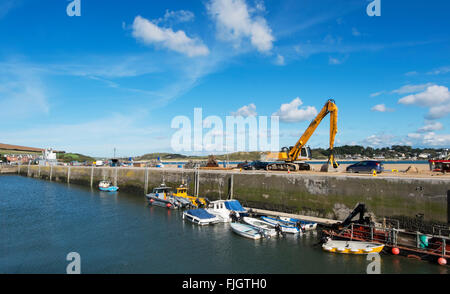 A digger on the quay used for helping to dredge the sand from the ...