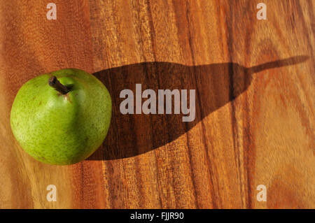 Pear fruit with a shadow Stock Photo - Alamy