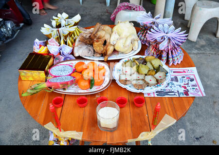 People putting Sacrificial offering food for pray to god and memorial ...