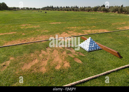 A Pyramid of practice golf balls Stock Photo - Alamy