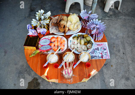 People putting Sacrificial offering food for pray to god and memorial ...