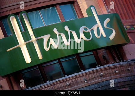 Illuminated Harrods sign and entrance canopy on the outside wall of the ...