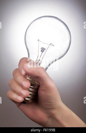 Light bulb on grey background Stock Photo - Alamy