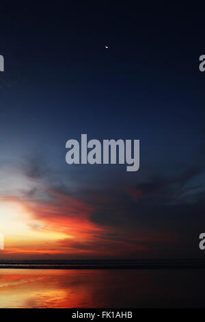 Radiant sea beach sunset on Bali Stock Photo - Alamy