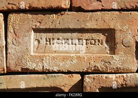 Old brick with the brickwork's mark "J W" imprinted into the face Stock ...