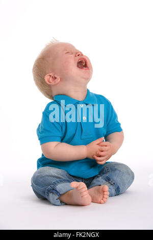 Blond kid crying very loud on the street Stock Photo - Alamy