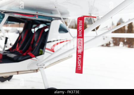 Red remove before flight tag on aircraft, to remind the pilot to make ...