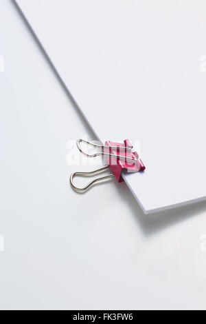 Alligator clip on paper Stock Photo - Alamy