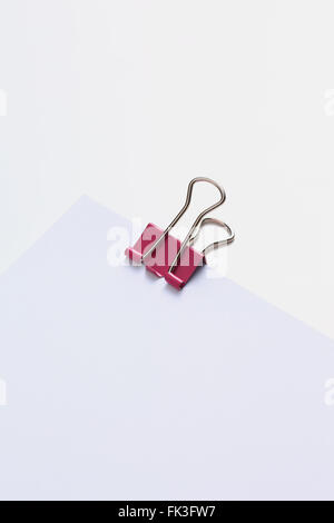 Alligator clip on paper Stock Photo - Alamy