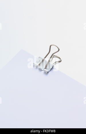 Alligator clip on paper Stock Photo - Alamy