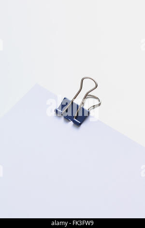 Alligator clip on paper Stock Photo - Alamy
