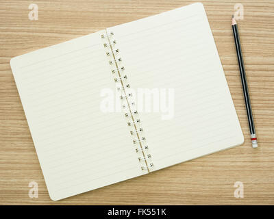 top view of opened blank notebook and math education numbers on pink ...