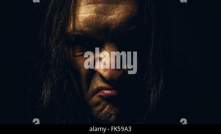 Portrait of a man, with serious and full of anger and hate face ...