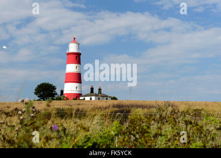 Red and white painted lighthouse at Happisburgh in Norfolk England ...