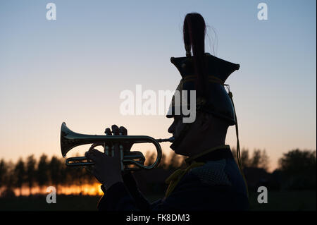 Silhouette of a man playing a bugle Stock Photo - Alamy