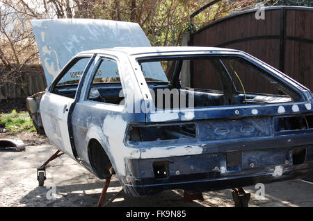 Old car chassis in preparation for painting Stock Photo - Alamy