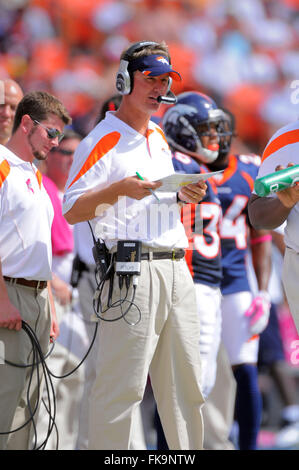 Denver Broncos offensive coordinator Mike McCoy takes part in drills ...