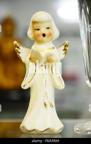 Figure little angel reading bible book Stock Photo - Alamy