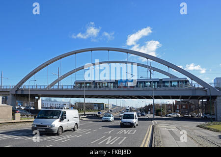 tram bridge, with tram passing over the ring road, Nottingham, England ...
