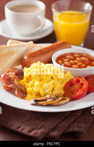 Appetizing breakfast with orange juice, tea, fruits, berries ...