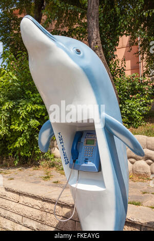 Public telephone booth in the shape of a bird of prey Stock Photo - Alamy