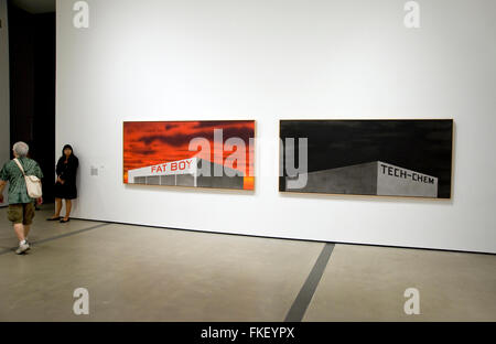 Visitors looking at Ed Ruscha painting Norm's La Cienega on Fire in a ...