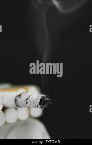 close up of a cigarette smouldering Stock Photo - Alamy