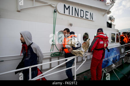 Rescuers use rubber boat during the search for missing people at ...