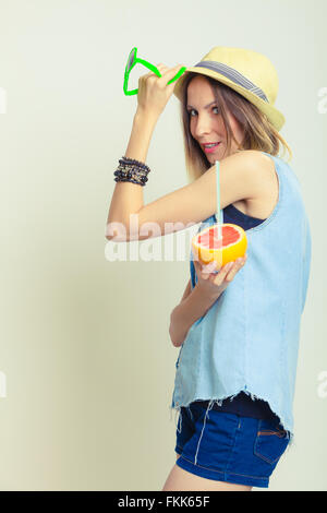 Summer girl holding grapefruit. Happy tourist enjoyed vacation Stock ...