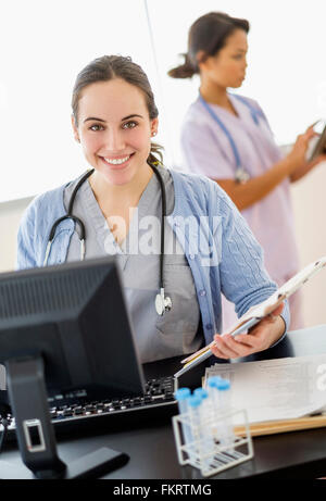 Nurse holding a chart Stock Photo - Alamy