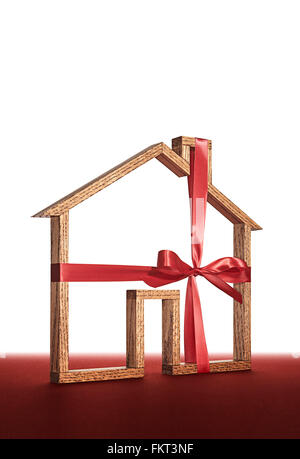 House shape wrapped in ribbon Stock Photo - Alamy