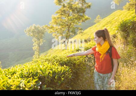 India, Kerala, Munnar, young female child dressed in frilly blue dress ...