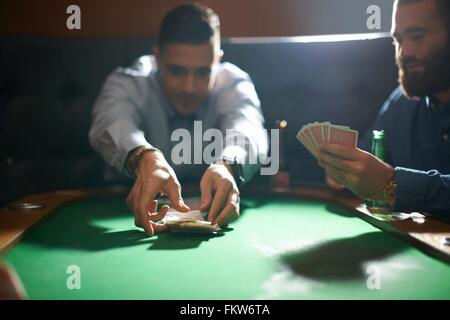 Man picking a playing card Stock Photo - Alamy