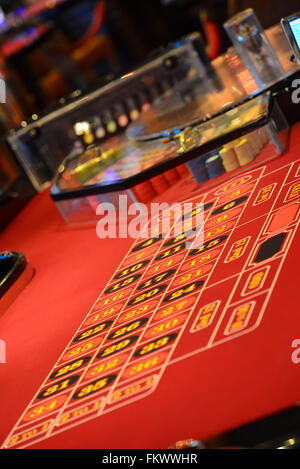 Roulette wheel in motion in a casino background Stock Photo - Alamy