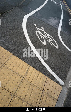Tactile paving at the crossing point of a road to help visually ...