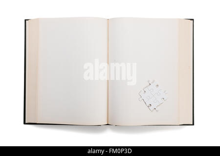 open book and puzzle, concept of solution Stock Photo - Alamy