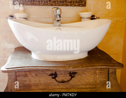 Closeup of modern bathroom sink with vintage soap bar container holder ...