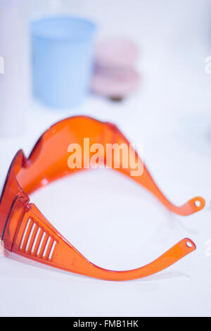 Dentist's glasses protective orange goggles Stock Photo - Alamy