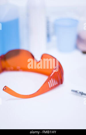 Dentist's glasses protective orange goggles Stock Photo - Alamy