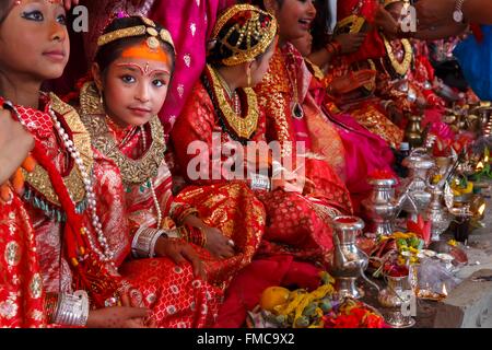 Nepal, Bagmati zone, Bhaktapur, Bel Bibaha girl watching a goat ...