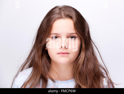 Sad girl on grey background Stock Photo - Alamy