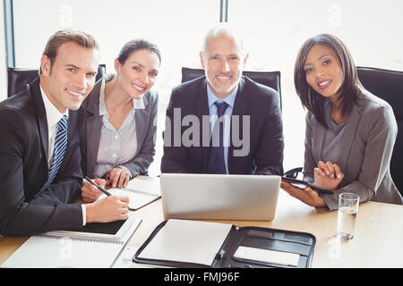 Businesspeople smiling in conference room Stock Photo - Alamy