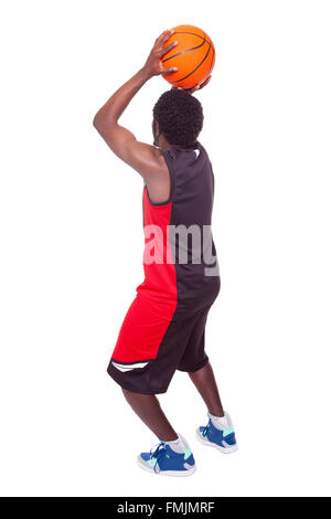A Shadow Basketball player dunking on red court Stock Photo - Alamy