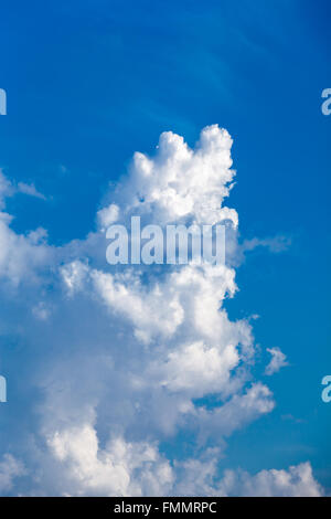 White fluffy clouds pillar in blue sky Stock Photo - Alamy