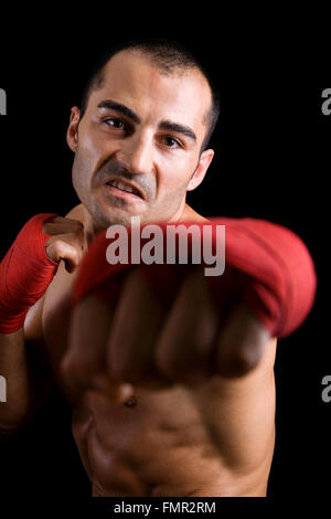 Young Boxer fighter over black background Stock Photo - Alamy